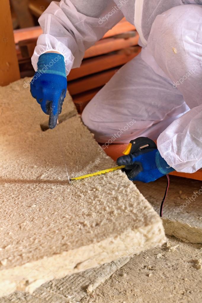 Man laying thermal insulation layer - closeup Stock Photo by ...