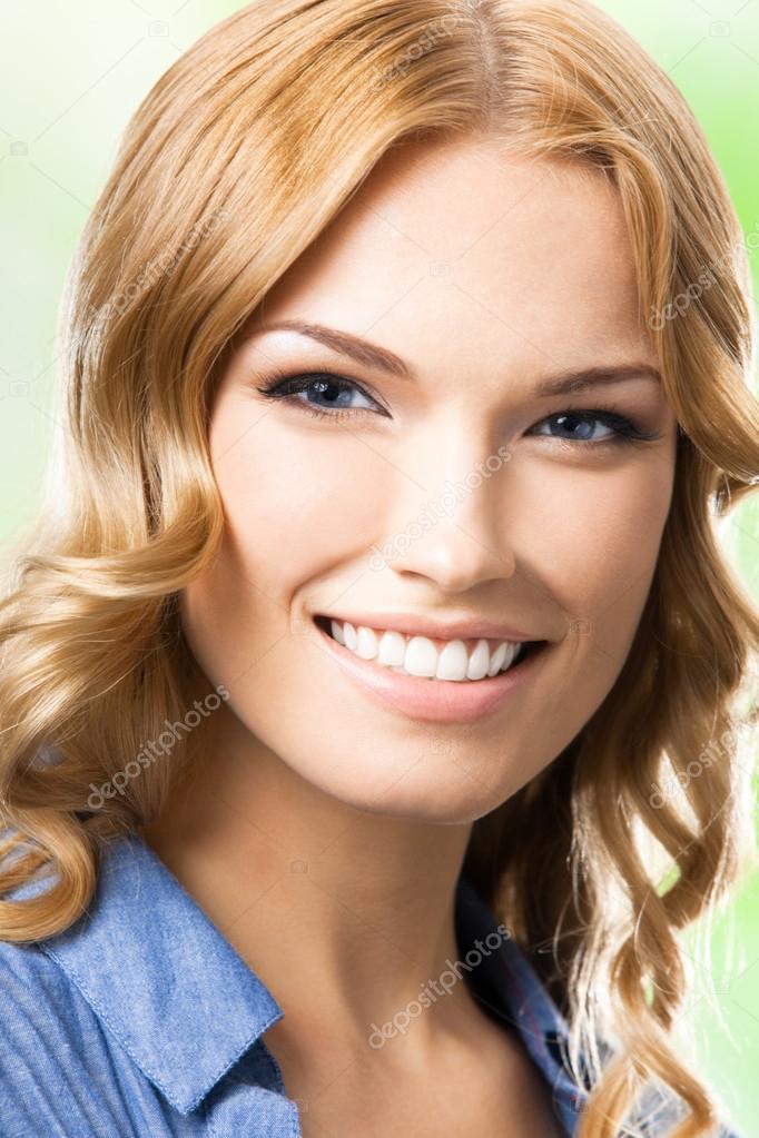 Happy smiling woman with long hair, outdoor — Stock Photo © g_studio ...