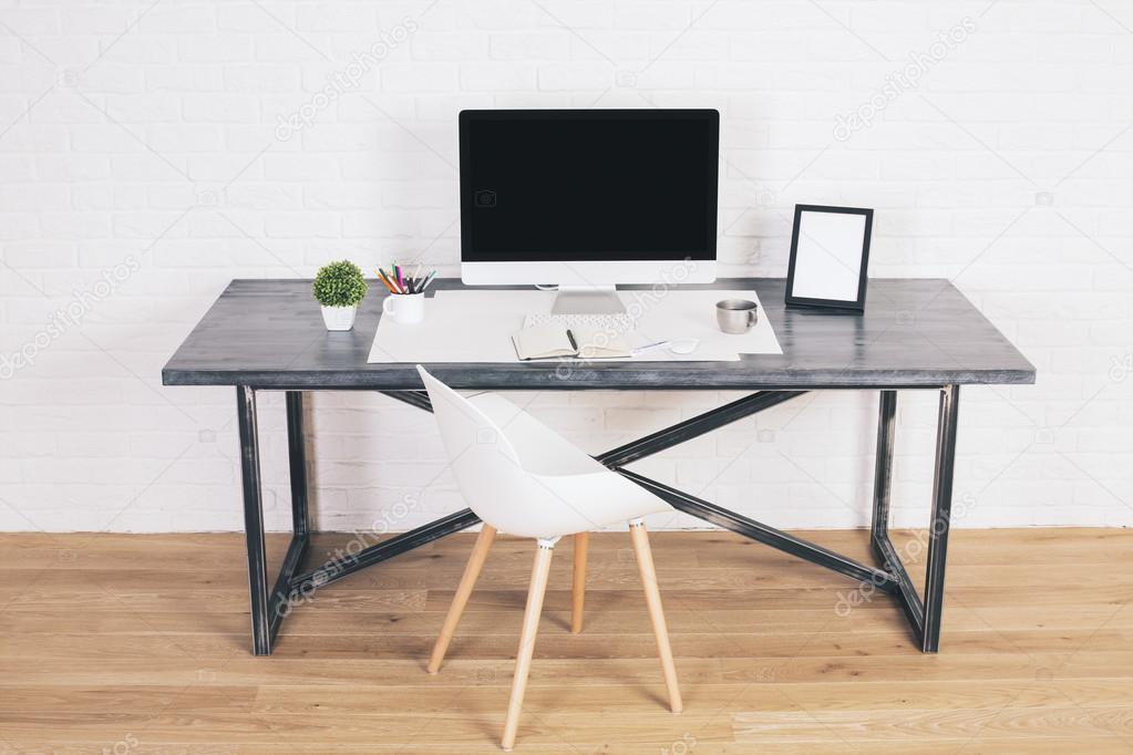 Desk with frames and monitor — Stock Photo © peshkova #112212384
