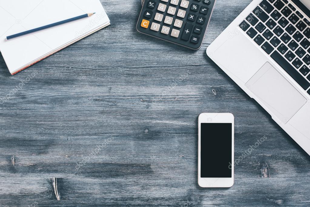 Office desk with smartphone Stock Photo by ©peshkova 116083764