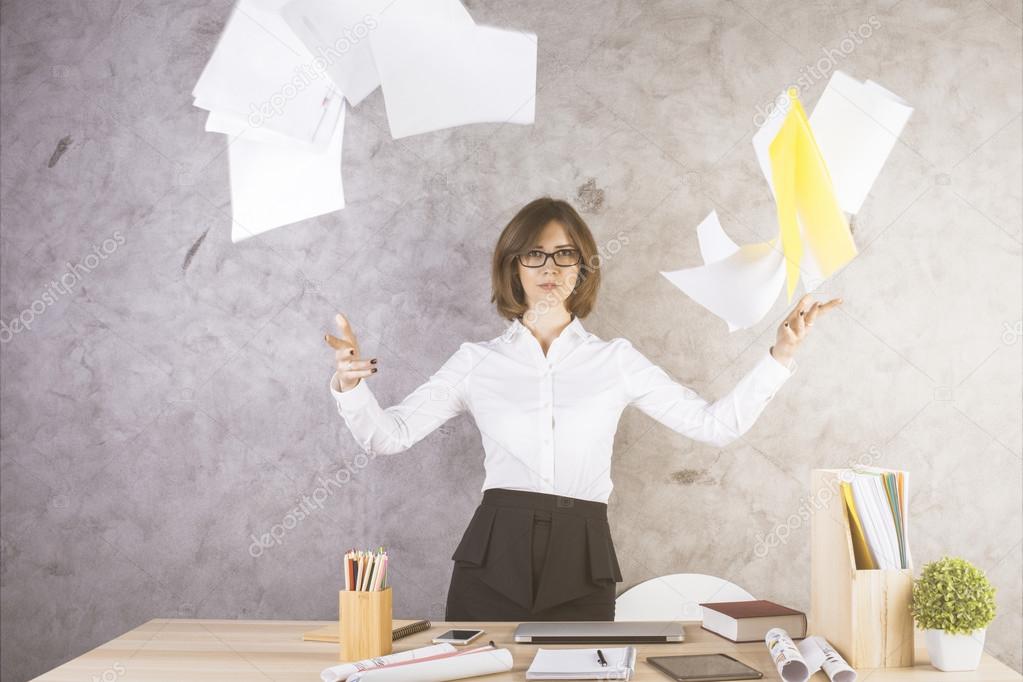 Female throwing papers Stock Photo by ©peshkova 118516402