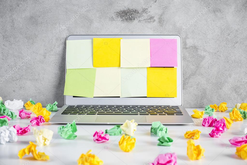 Messy desktop with laptop and stickers — Stock Photo © peshkova #119237390