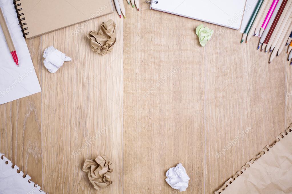 Messy desktop with stationery items Stock Photo by ©peshkova 120169958