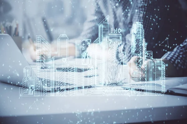 High tech city drawing with businessman working on computer on ...