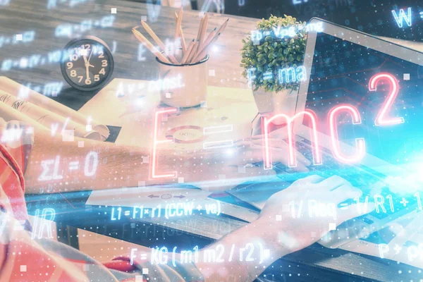 Science formula hologram with man working on computer on background ...