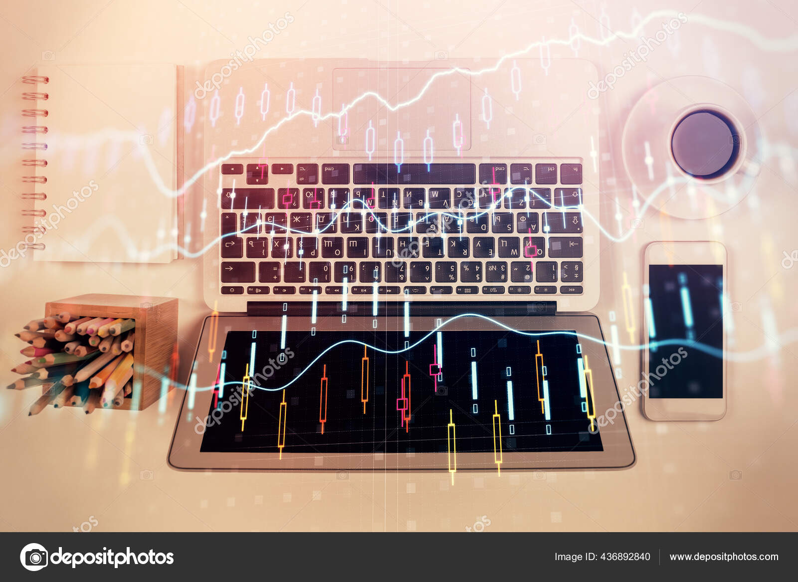 Stock market chart and top view computer on the table background. Multi ...