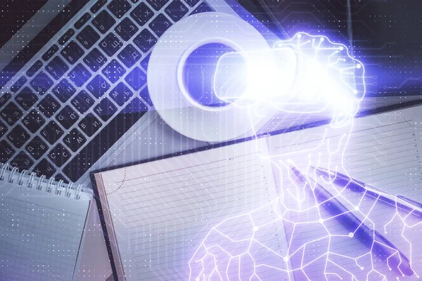 AR hologram drawings over computer on the desktop background. Top view ...