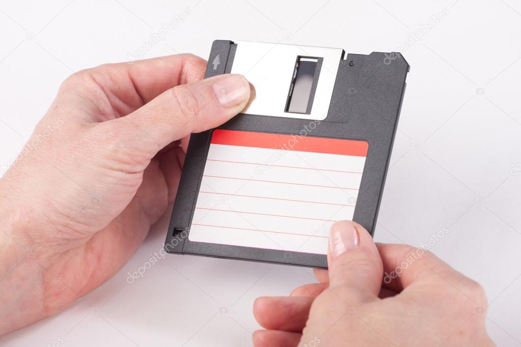 Female hands holding floppy disk — Stock Photo © Alexandre17 #64731249