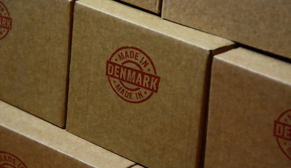 Made in Denmark stamp printed on cardboard box. Factory, manufacturing ...