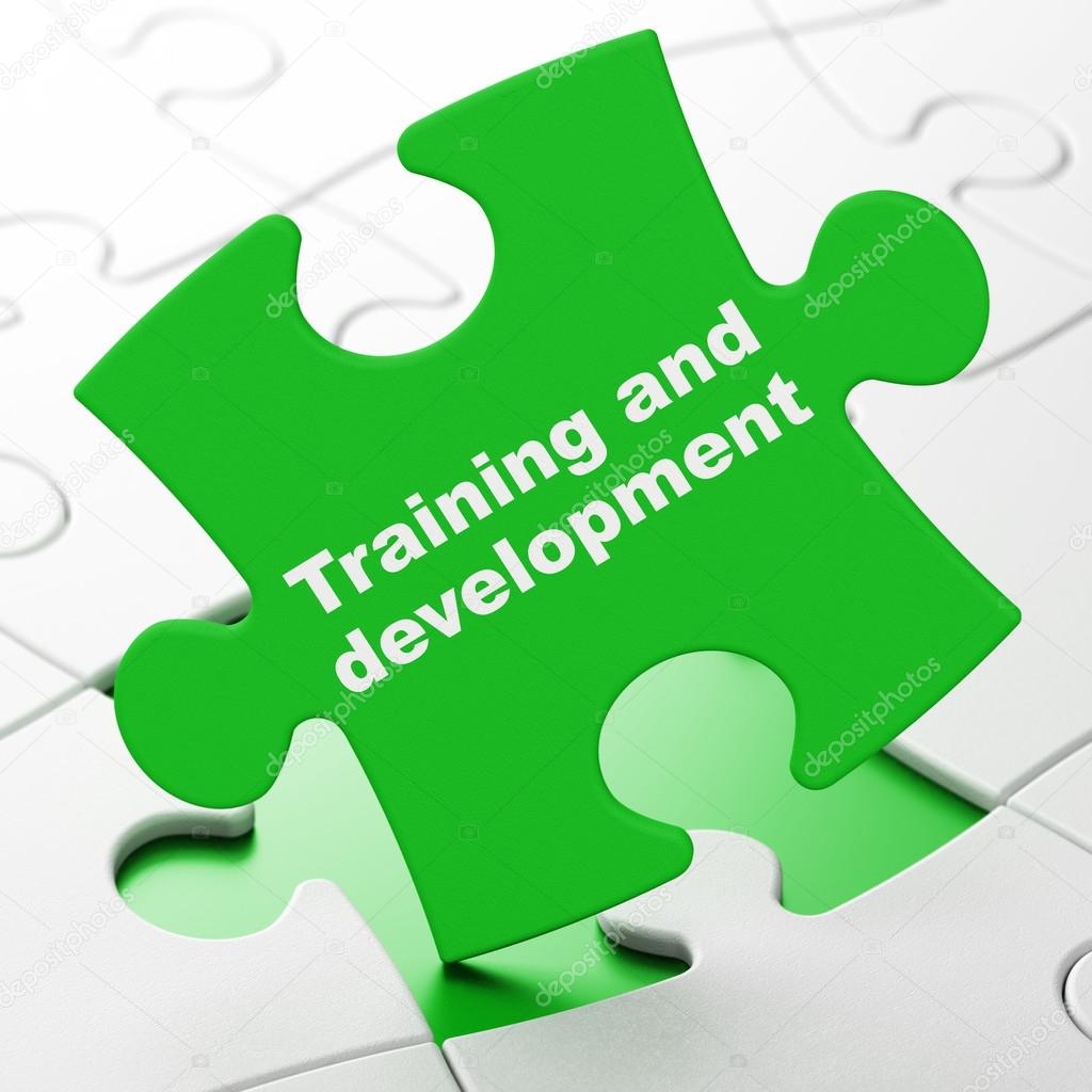 Education concept: Training and Development on puzzle background ...