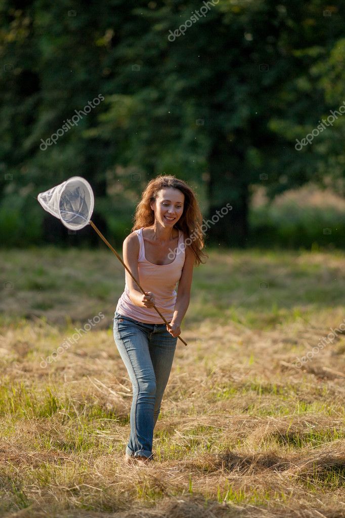 Girl with butterfly net — Stock Photo © NikitaN #120344892