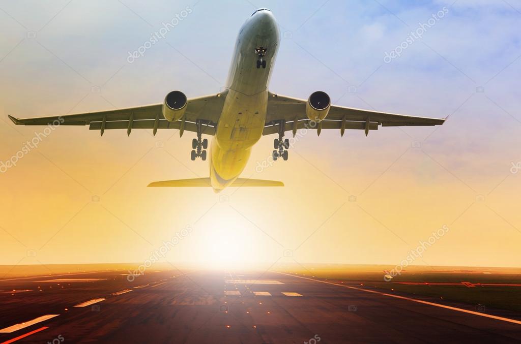 Passenger jet plane take off fron airport runway with beautiful — Stock ...