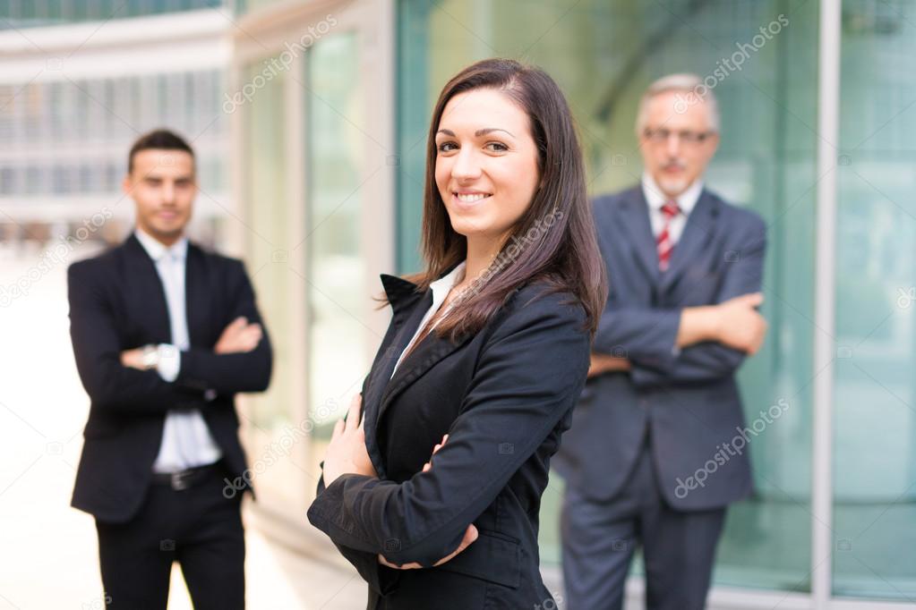 Employees standing outdoors Stock Photo by ©minervastock 101090218