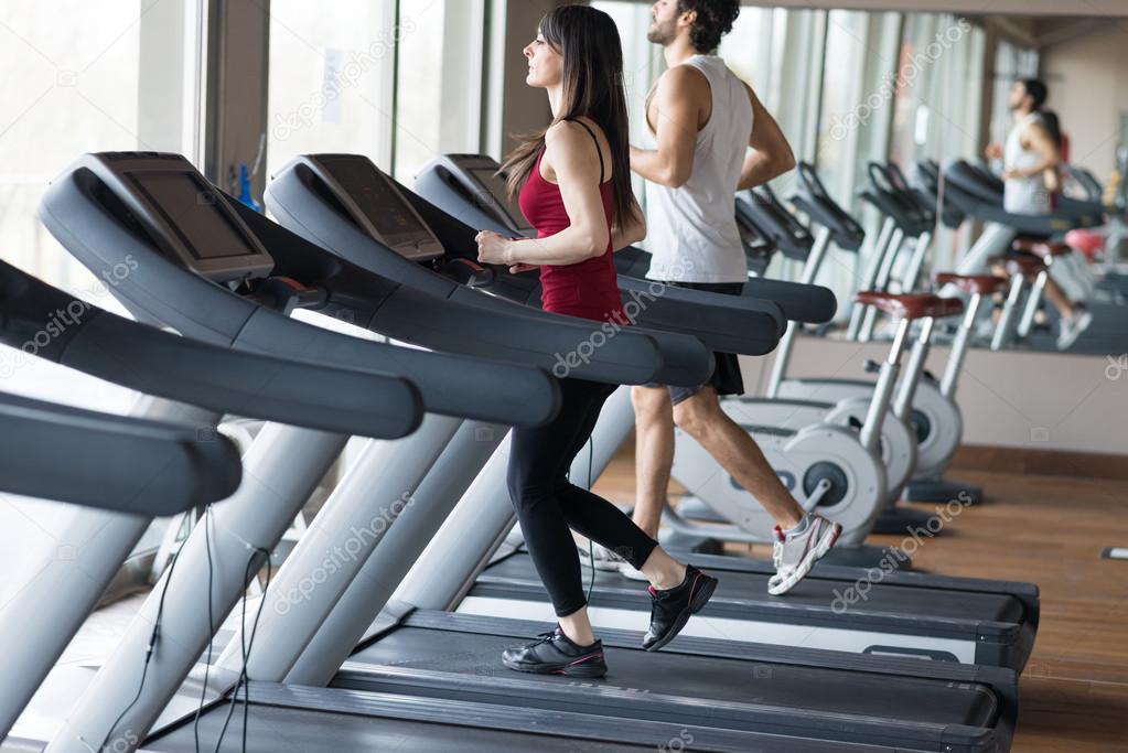 People running on a treadmill Stock Photo by ©minervastock 113144222
