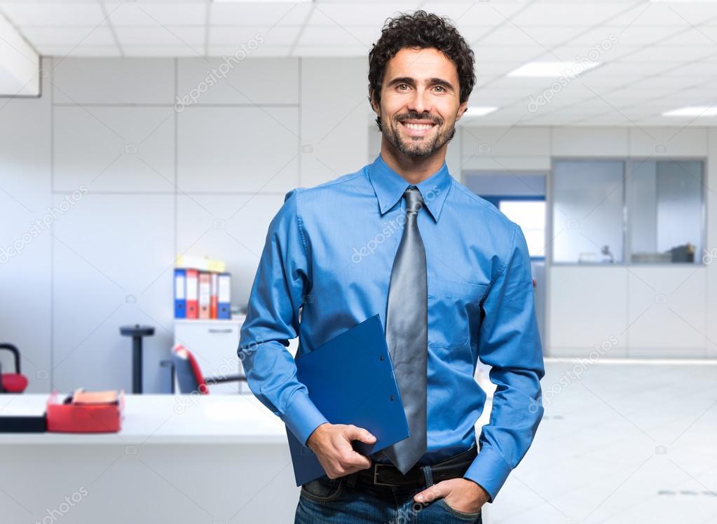 Handsome male manager Stock Photo by ©minervastock 114726186