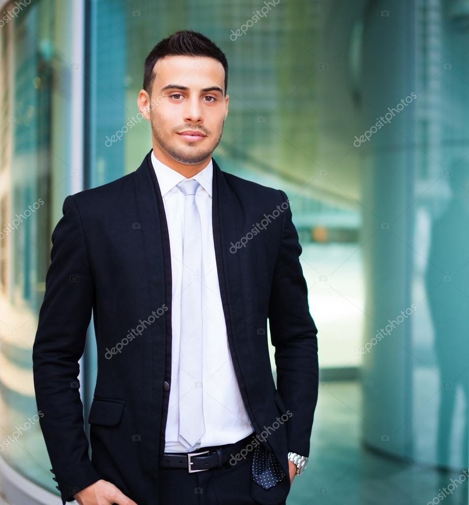 Handsome smiling business man — Stock Photo © minervastock #59864511 Handsome smiling business man — Stock Photo © minervastock #59864511