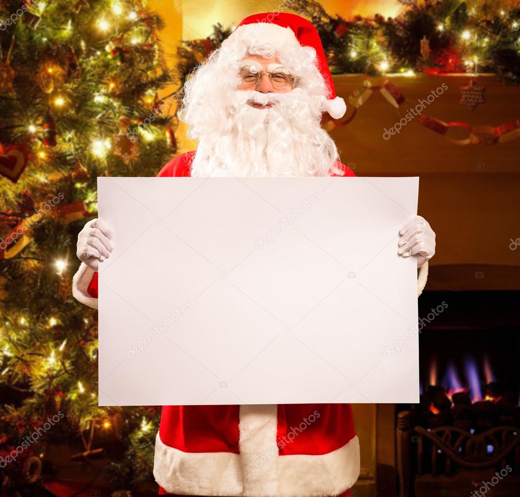 Santa Claus holding blank sign Stock Photo by ©minervastock 59864533