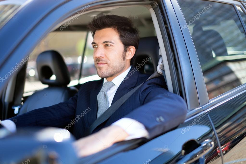 Handsome man driving his car — Stock Photo © minervastock #61558951