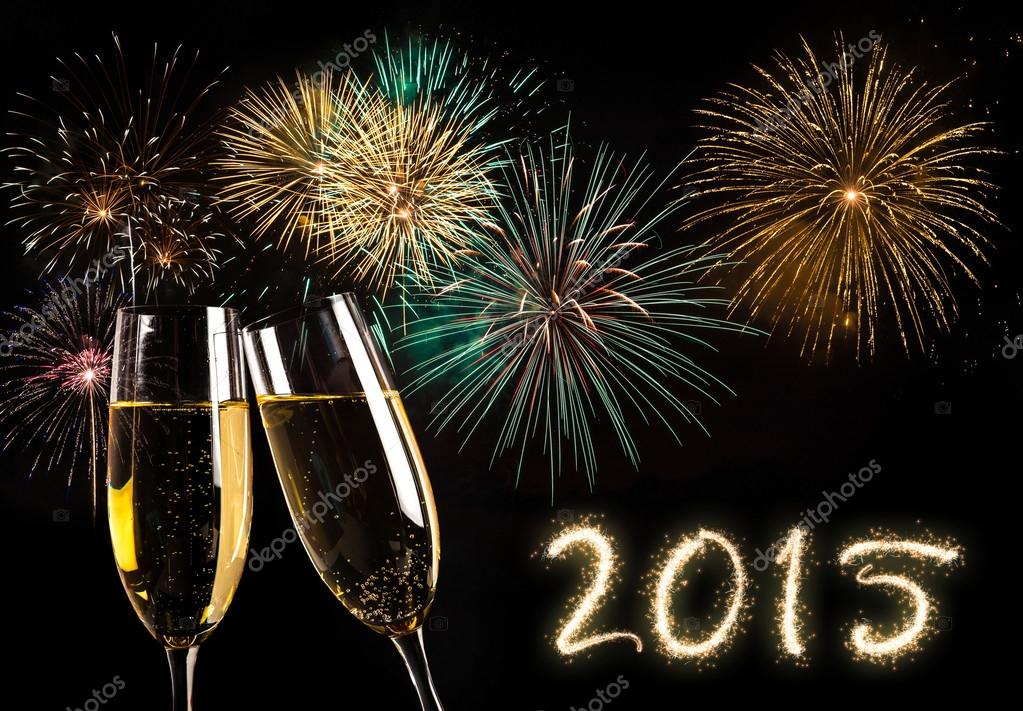 Champagne flutes and fireworks in the background Stock Photo by ...