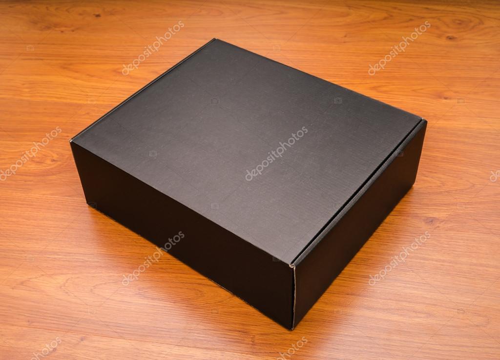 Blank black box mock up on wood background Stock Photo by ...
