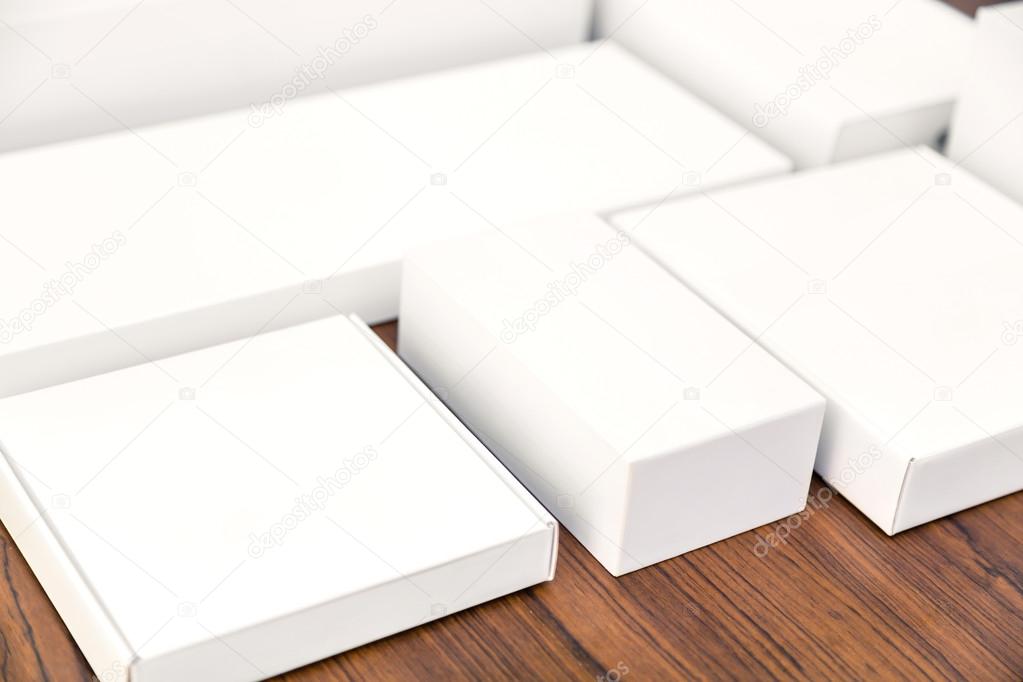 Blank white box mock up on wood background — Stock Photo ...