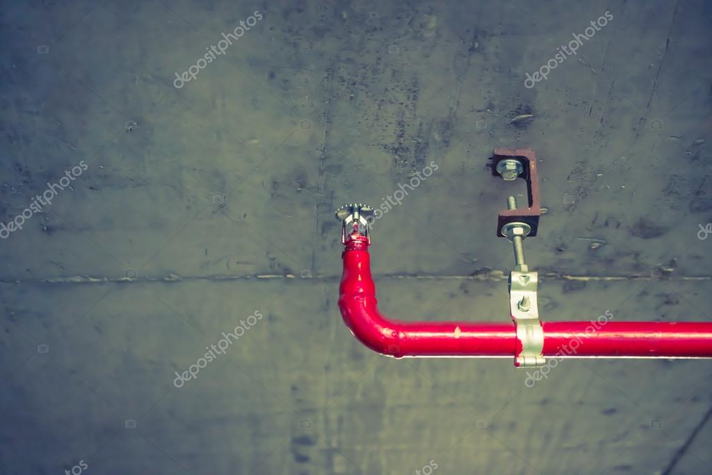Fire sprinkler and red pipe — Stock Photo © jannystockphoto #84456680