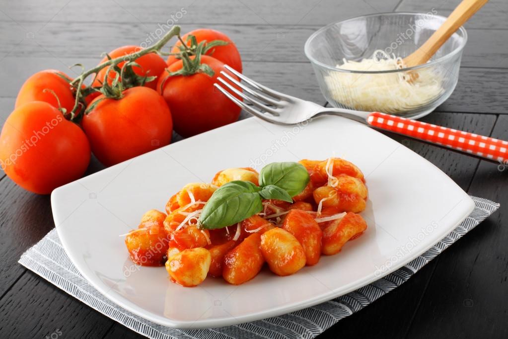 Gnocchi with tomato sauce and basil Stock Photo by ©lorenzograph 108371492