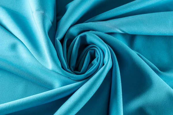 sky blue fabric for tailoring rolled into a spiral, background - Stock ...
