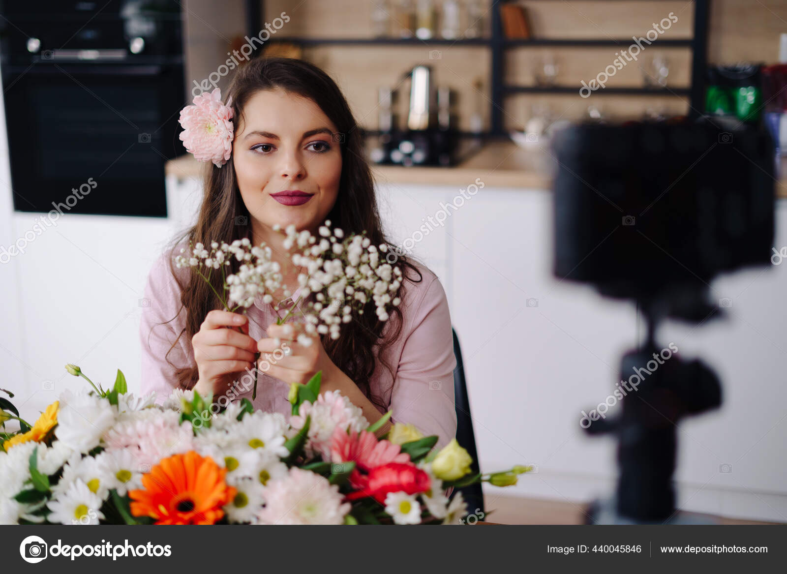 Woman using camera to stream home online tutorial on her blog — Stock ...