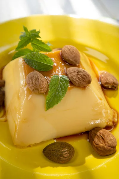 Presentation of a cren caramel vegan dish with almond flavor - Stock ...