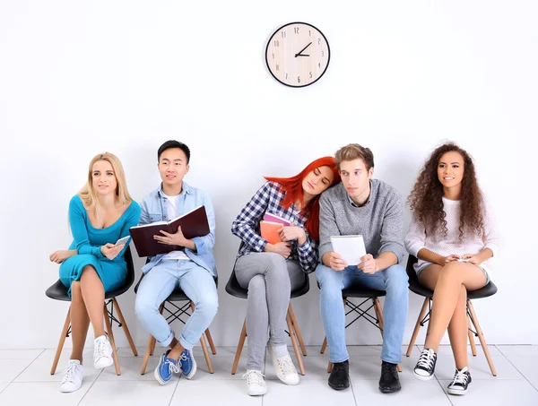People sitting on chairs Stock Photo by ©belchonock 98650316