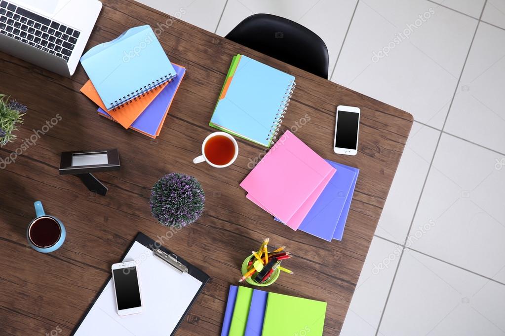Table with tablet, laptop, papers — Stock Photo © belchonock #100836292