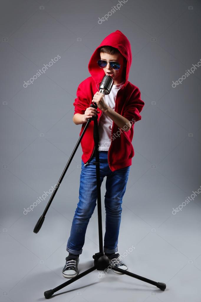 Little boy singing Stock Photo by ©belchonock 100926638