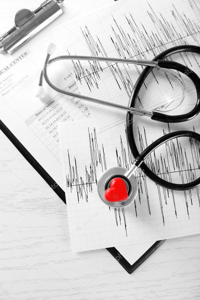 Cardiogram chart with medical stethoscope — Stock Photo © belchonock ...