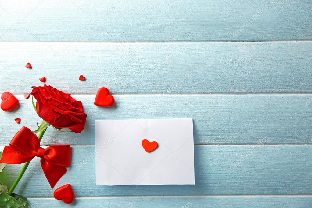 Beautiful rose with gift card Stock Photo by ©belchonock 101662984