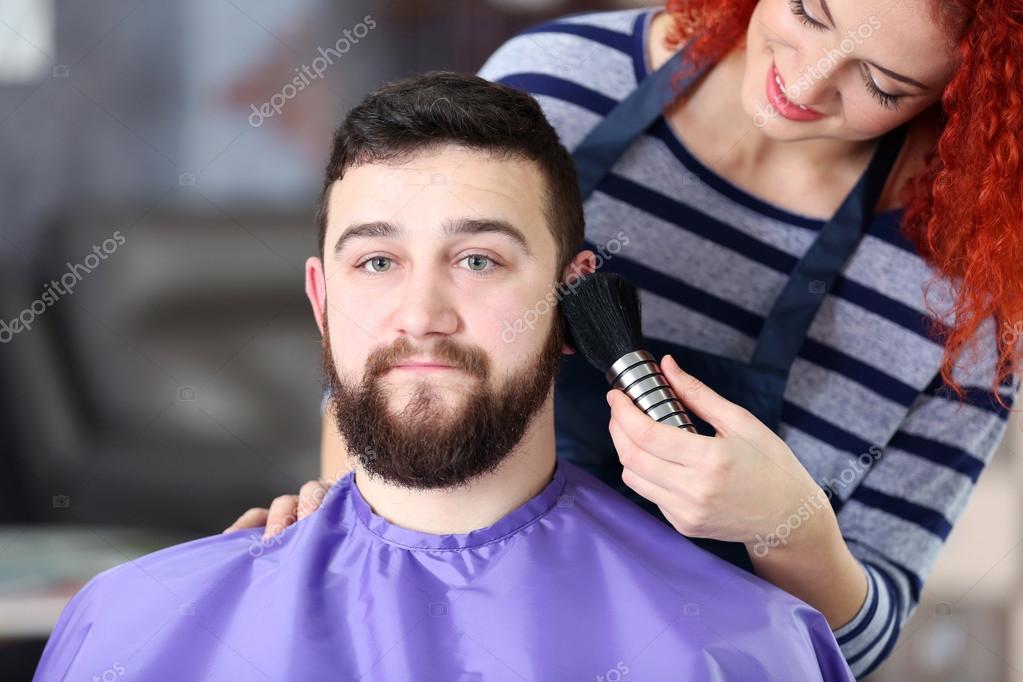 Hairdresser cleaning client face Stock Photo by ©belchonock 101671106