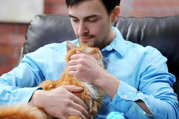 Man with fluffy cat - Stock Image - Everypixel