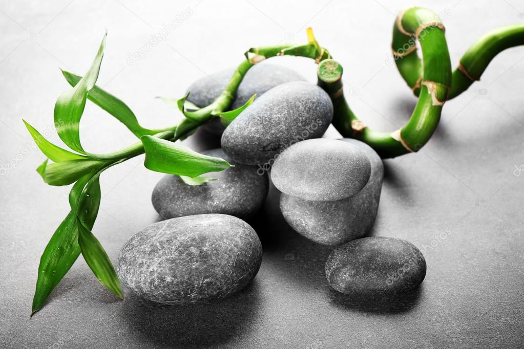 Hot spa stones with bamboo Stock Photo by ©belchonock 103306340