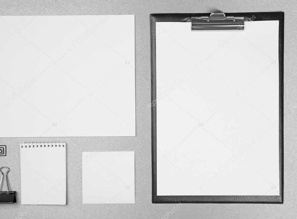 Office set with white sheets of paper Stock Photo by ©belchonock 103309922
