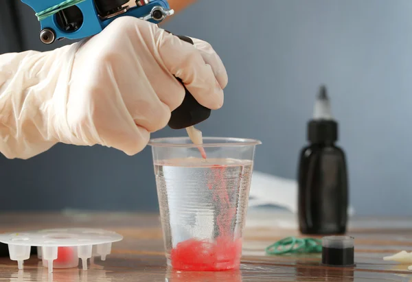 Preparation process for making tattoo Stock Photo by ©belchonock 110563422