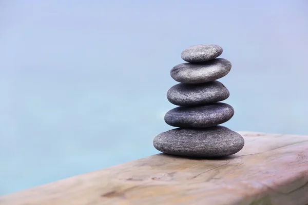 Pyramid of spa stones — Stock Photo © belchonock #62020579