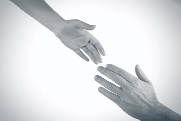 Two hands reaching each other — Stock Photo © belchonock #102116974