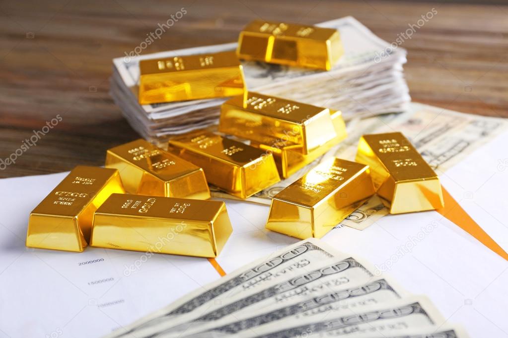 Gold bars with dollar banknotes — Stock Photo © belchonock #105172102