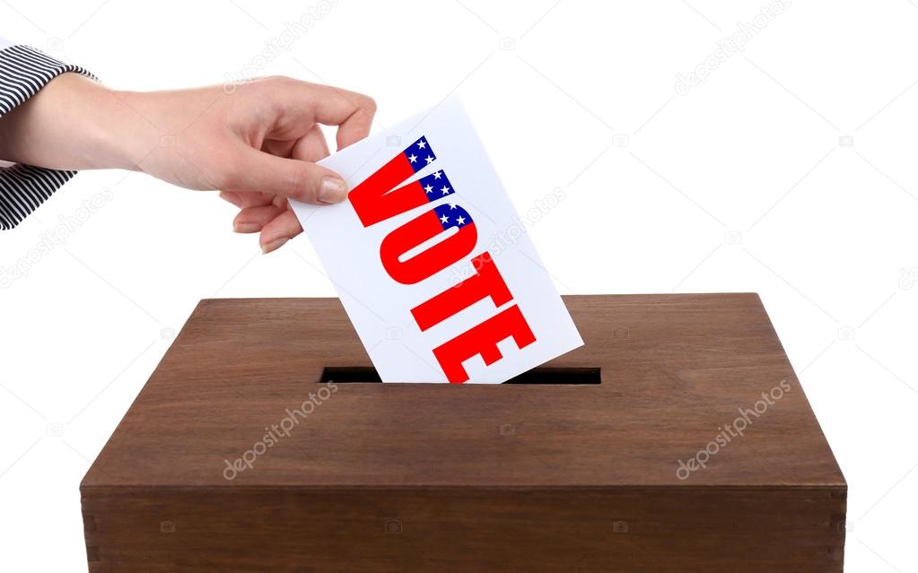 Hand inserting bulletin in ballot box — Stock Photo © belchonock #107724980