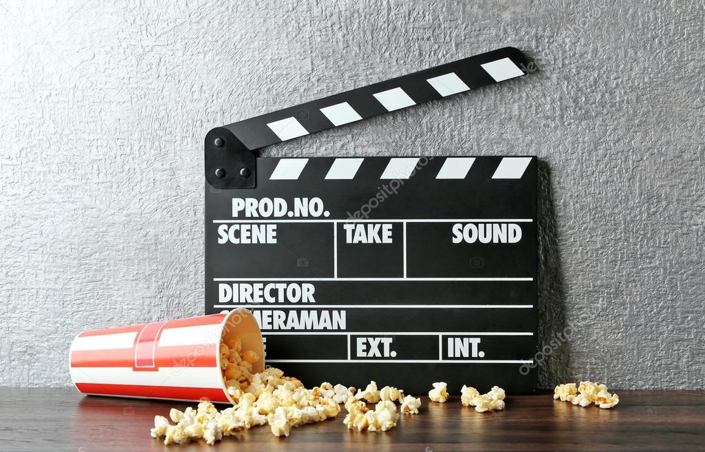 Movie clapper and popcorn — Stock Photo © belchonock #109372602