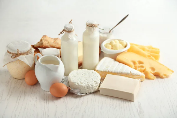 Set of fresh dairy products on wooden table, on white background Stock ...