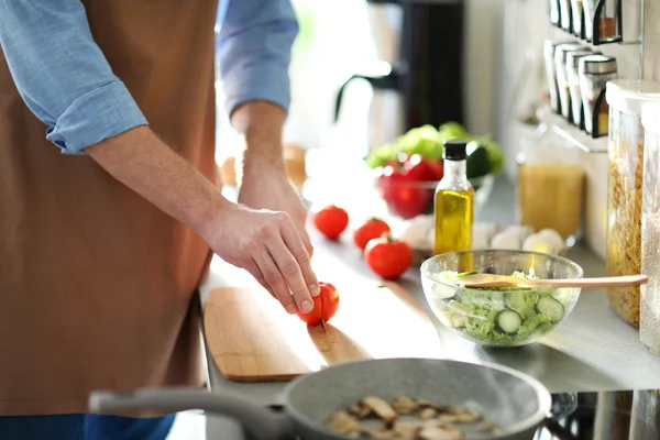 Man cooking dinner Stock Photos & Royalty-Free Images | Depositphotos