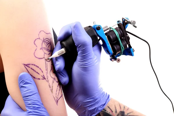 Tattooer showing process of making tattoo, close up — Stock Photo ...