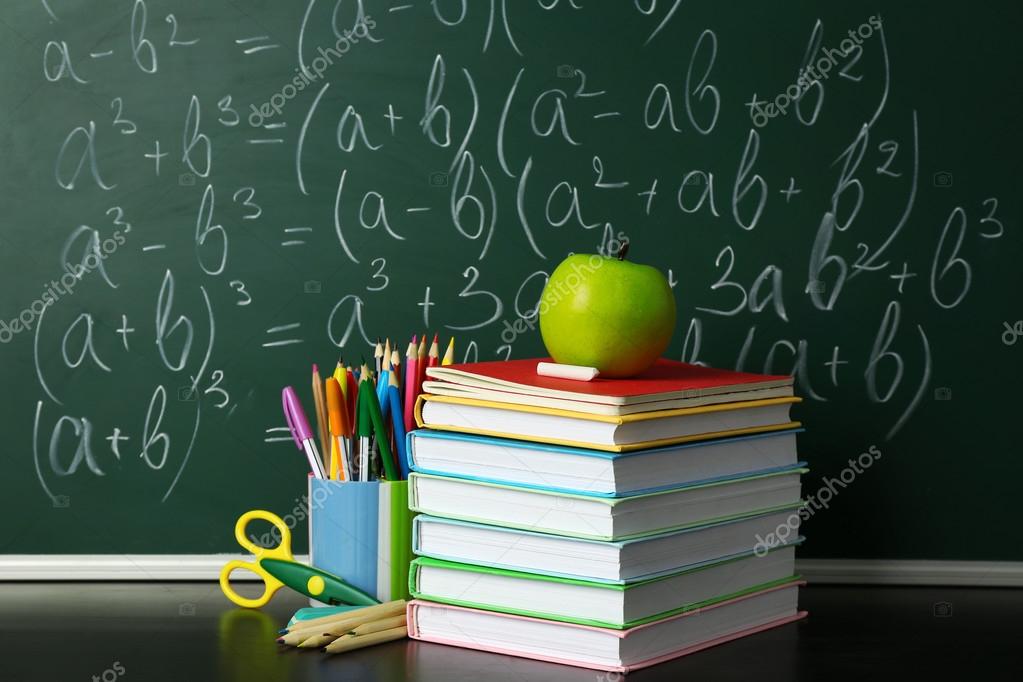 School books on desk Stock Photo by ©belchonock 110534022