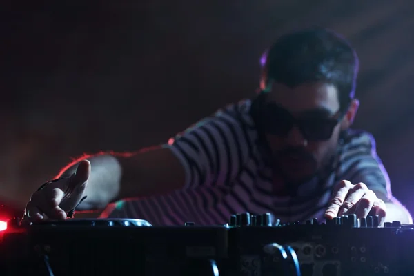DJ playing music at mixer - Stock Image - Everypixel